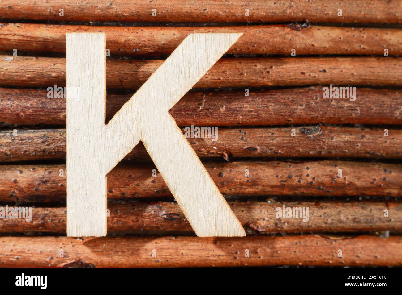 Letter K of wood-made alphabet, top view and space for text Stock Photo ...