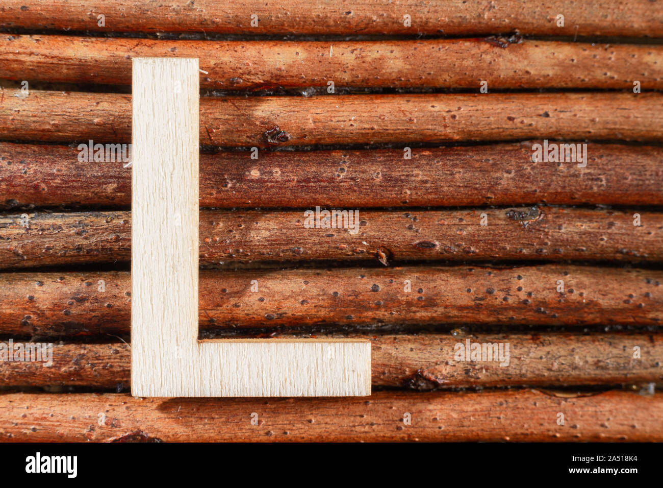 Letter L of wood-made alphabet, top view and space for text Stock Photo ...
