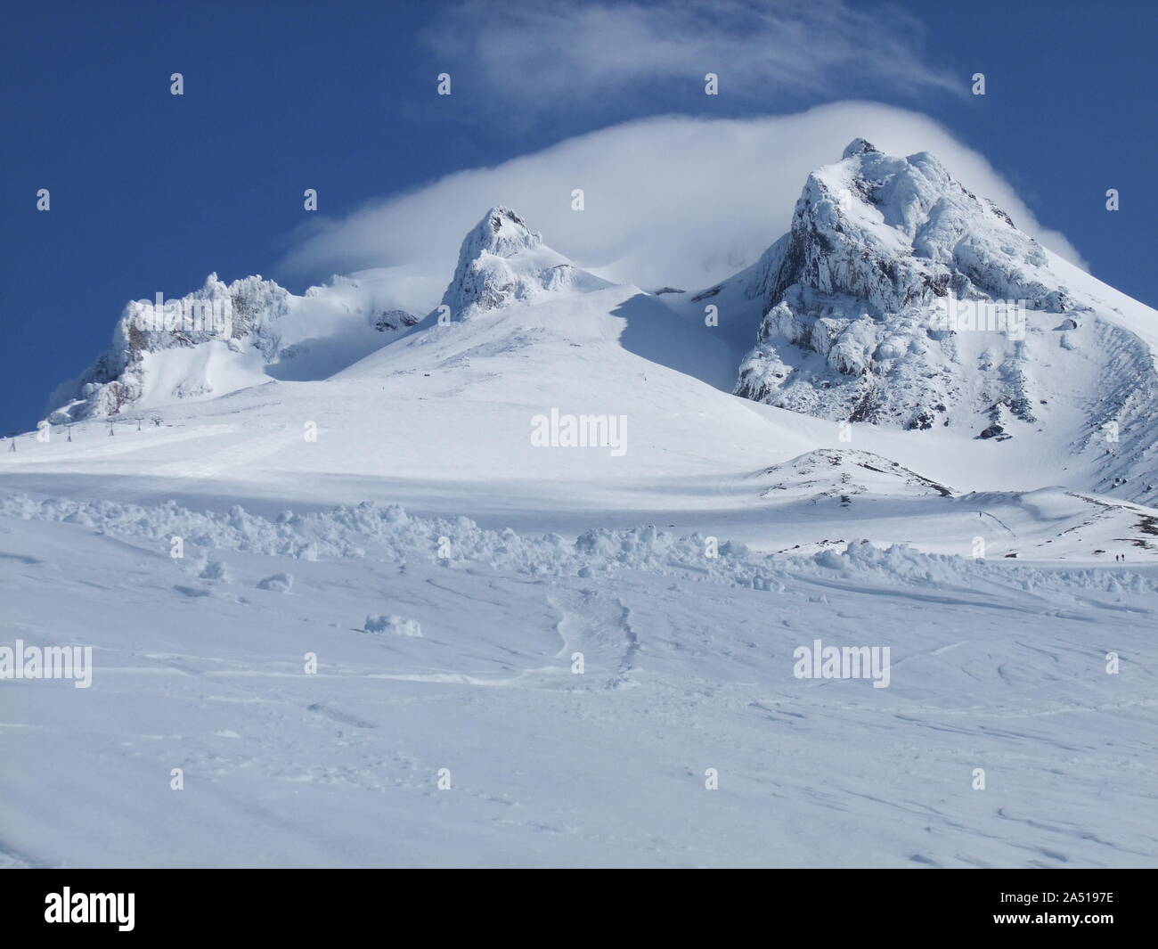 Mt. Hood's Summit is obscured by clouds but snow covered Crater Rock ...