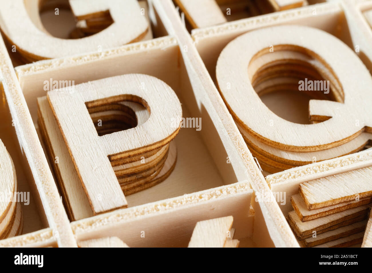 Alphabet letters in wooden box, top view Stock Photo - Alamy