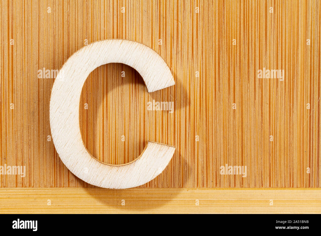 Letter C of wood-made alphabet, top view and space for text Stock Photo ...