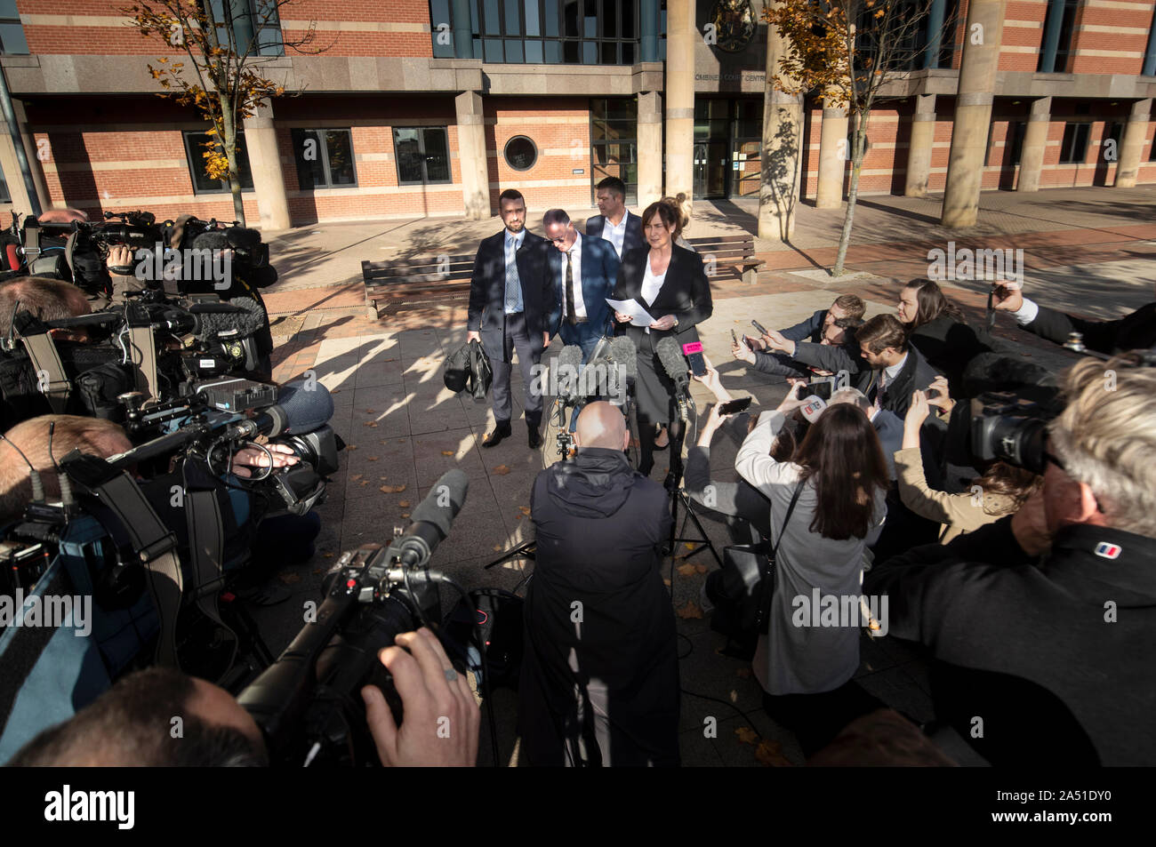 Solicitor Imogen Cox (right) reads a statement with former England ...