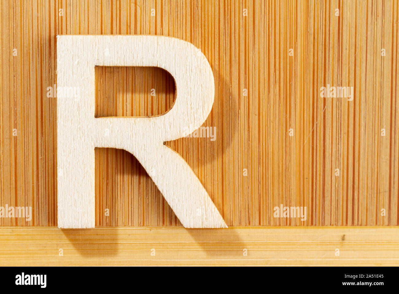 Letter R of wood-made alphabet, top view and space for text Stock Photo ...
