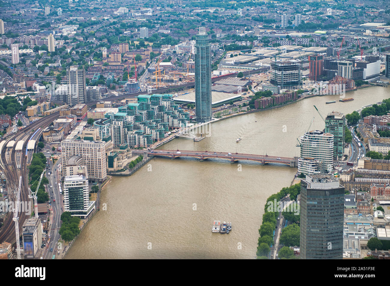 Aerial view of London skysline and River Thames as seen from helicopter ...