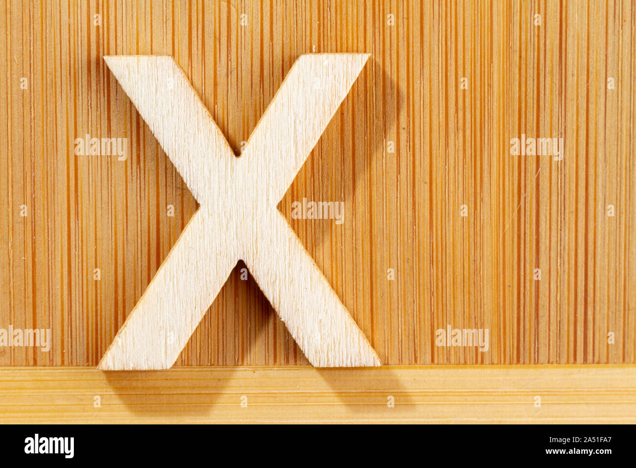 Letter X of wood-made alphabet, top view and space for text Stock Photo ...