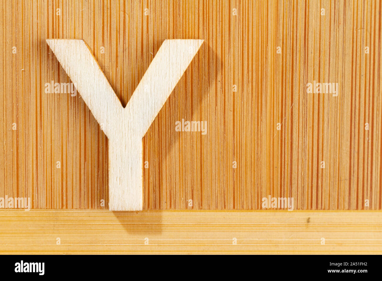 Letter Y of wood-made alphabet, top view and space for text Stock Photo ...