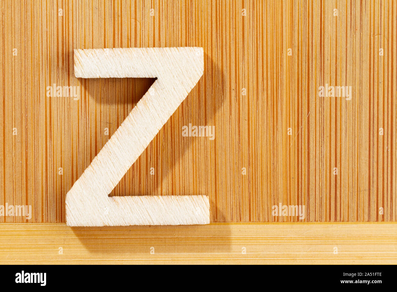 Letter Z of wood-made alphabet, top view and space for text Stock Photo ...