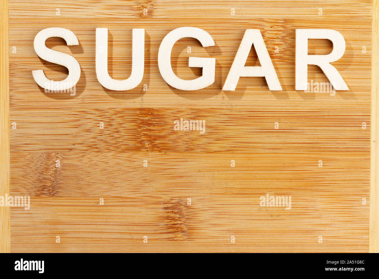 Word sugar written with wooden letters, space for text Stock Photo - Alamy