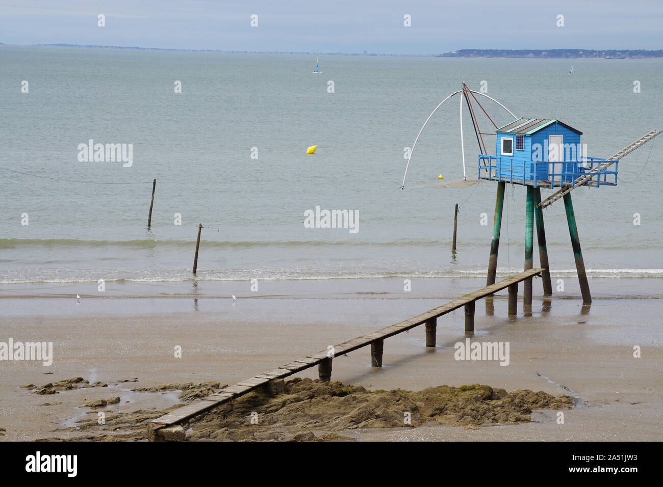 old blue wood fishing shack on stilts by the beach in Vendée, France ...