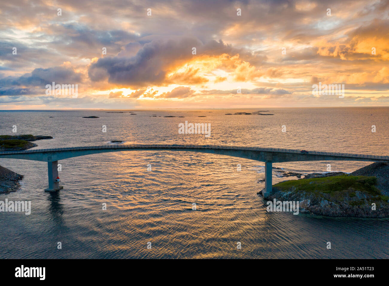 Lights of sunset reflected in the sea crossed by Storseisundet Bridge ...