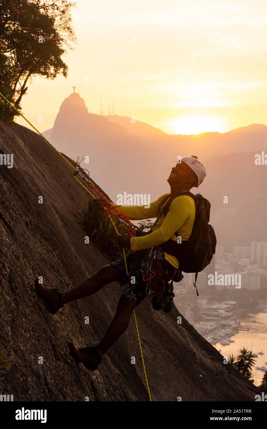 Man climbing on statue hi-res stock photography and images - Alamy