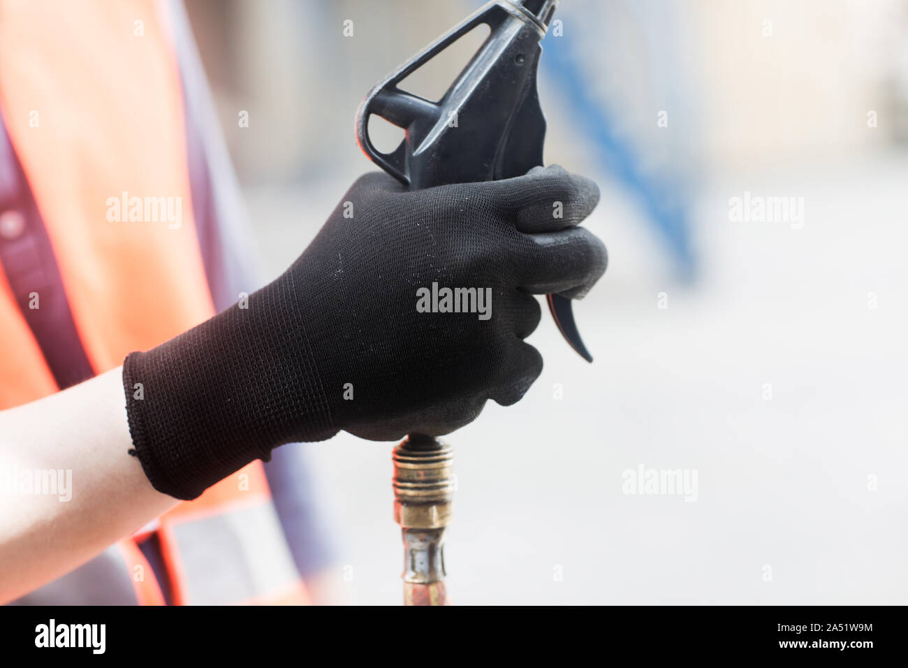 hand with gloves of a worker with tool Stock Photo - Alamy