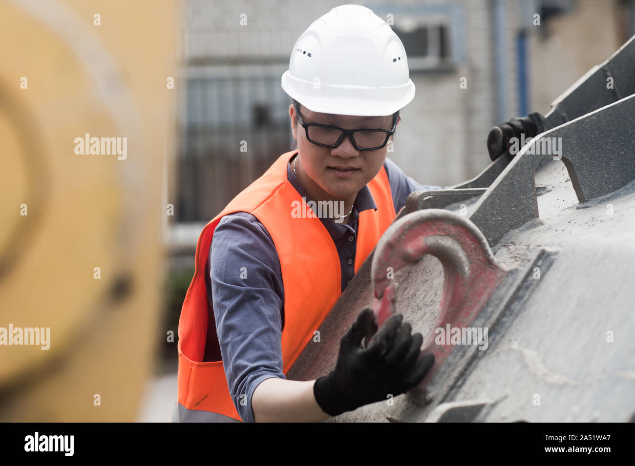 young worker in a concrete factory Stock Photo - Alamy