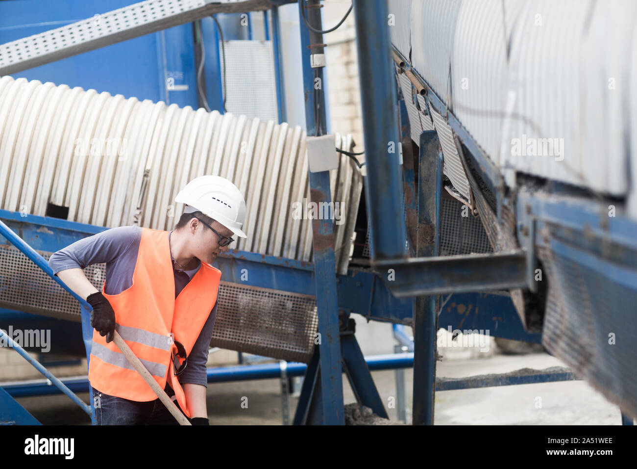 young worker in a concrete factory Stock Photo - Alamy