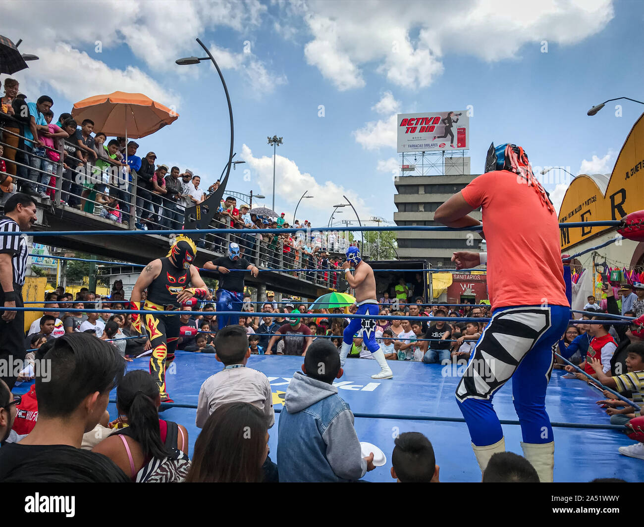 Mexican wrestling casual walking on esplanade public market in Mexico ...