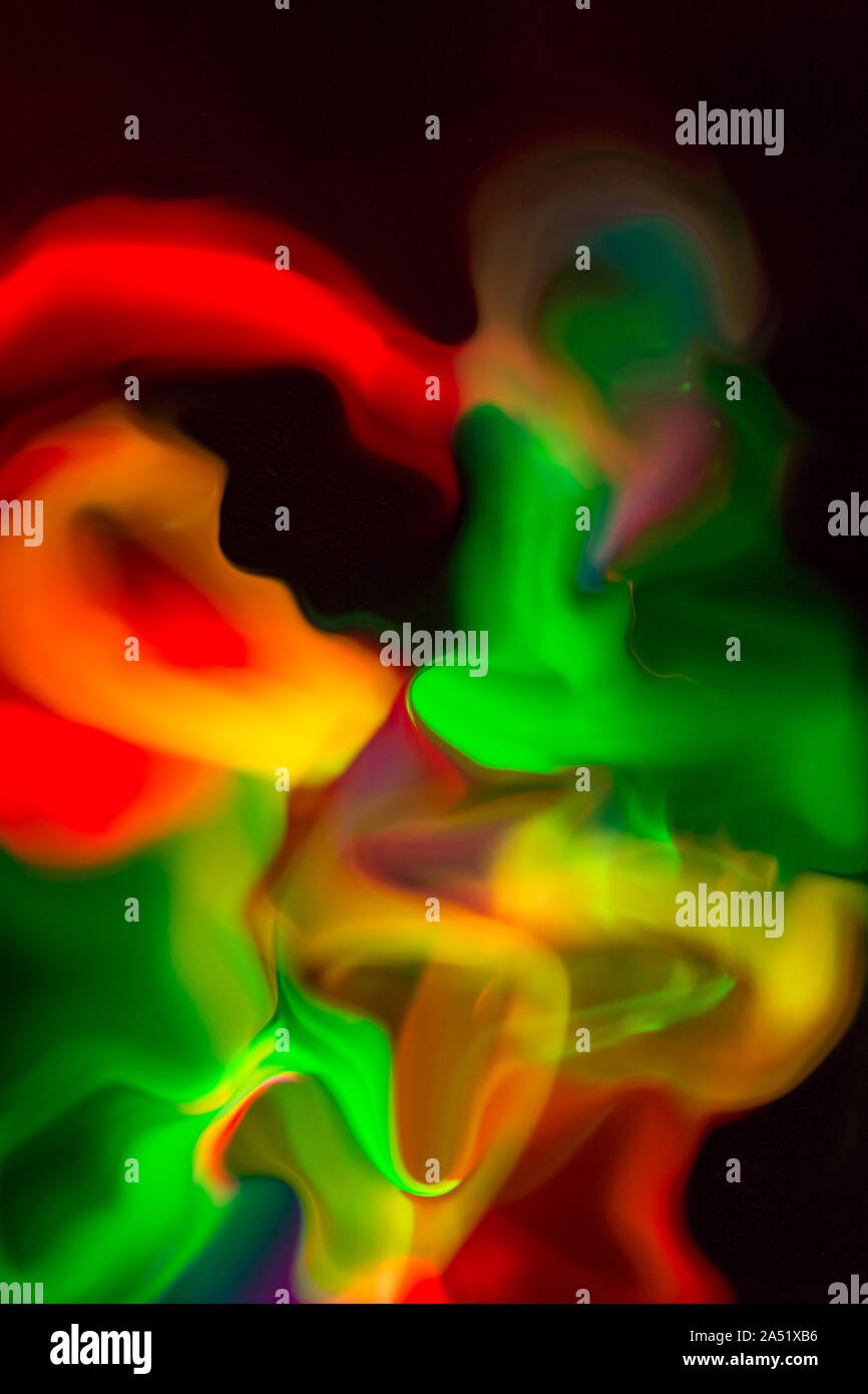 Fluid light painting with neon colors on dark background Stock Photo ...