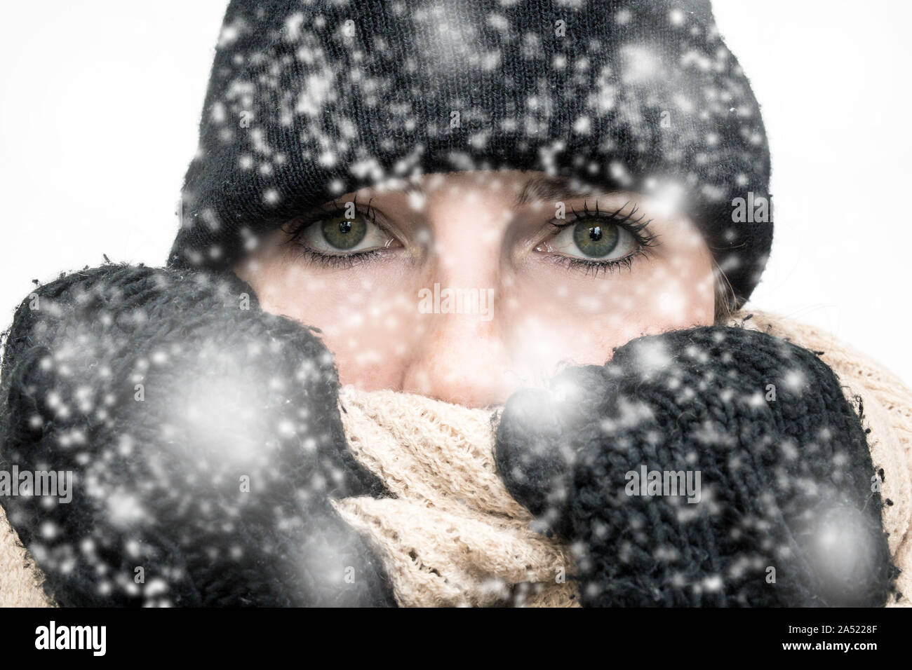 Woman in the Snow with winter wearing, wrapped in winter cap and scarf ...
