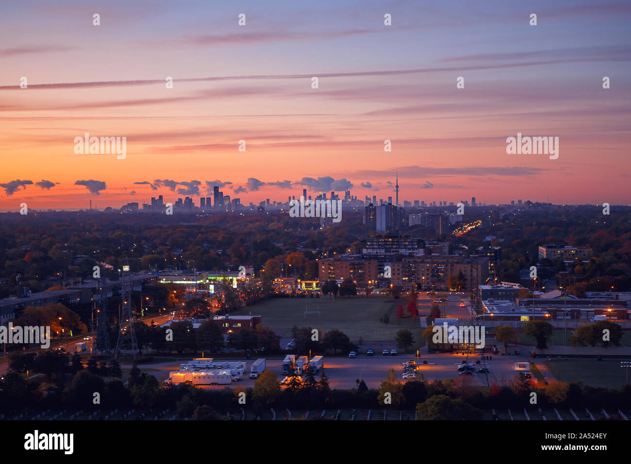 Beautiful pink yellow purple morning sky clouds in Toronto city, Canada ...