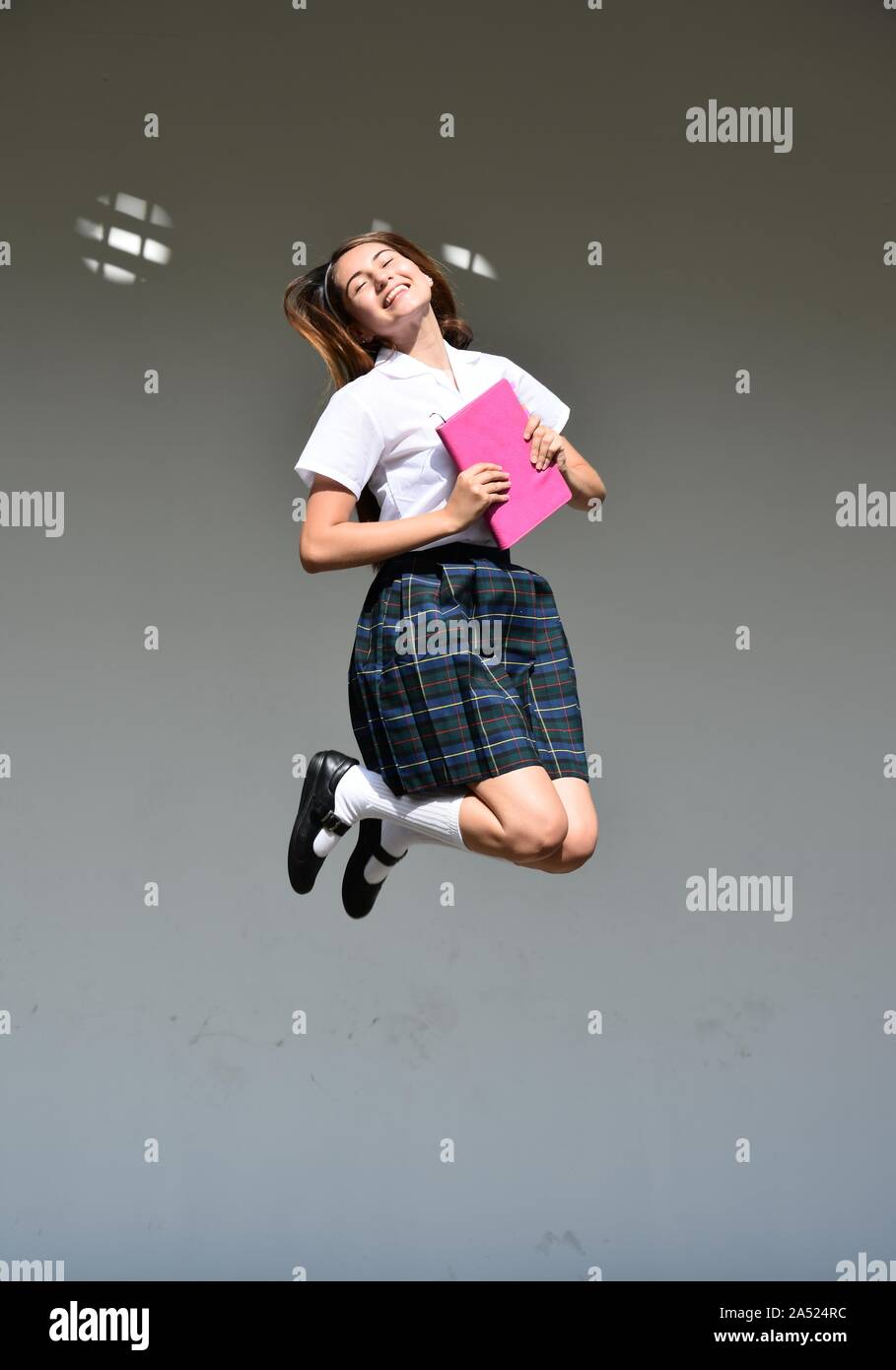 Female Student Teenager Jumping Stock Photo - Alamy