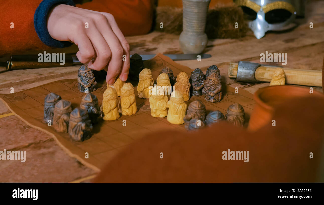 Man in russian ethnic suit playing chess Stock Photo - Alamy