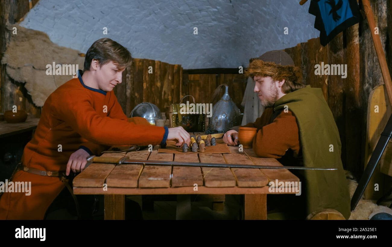Two men playing popular strategy board game - tafl Stock Photo - Alamy