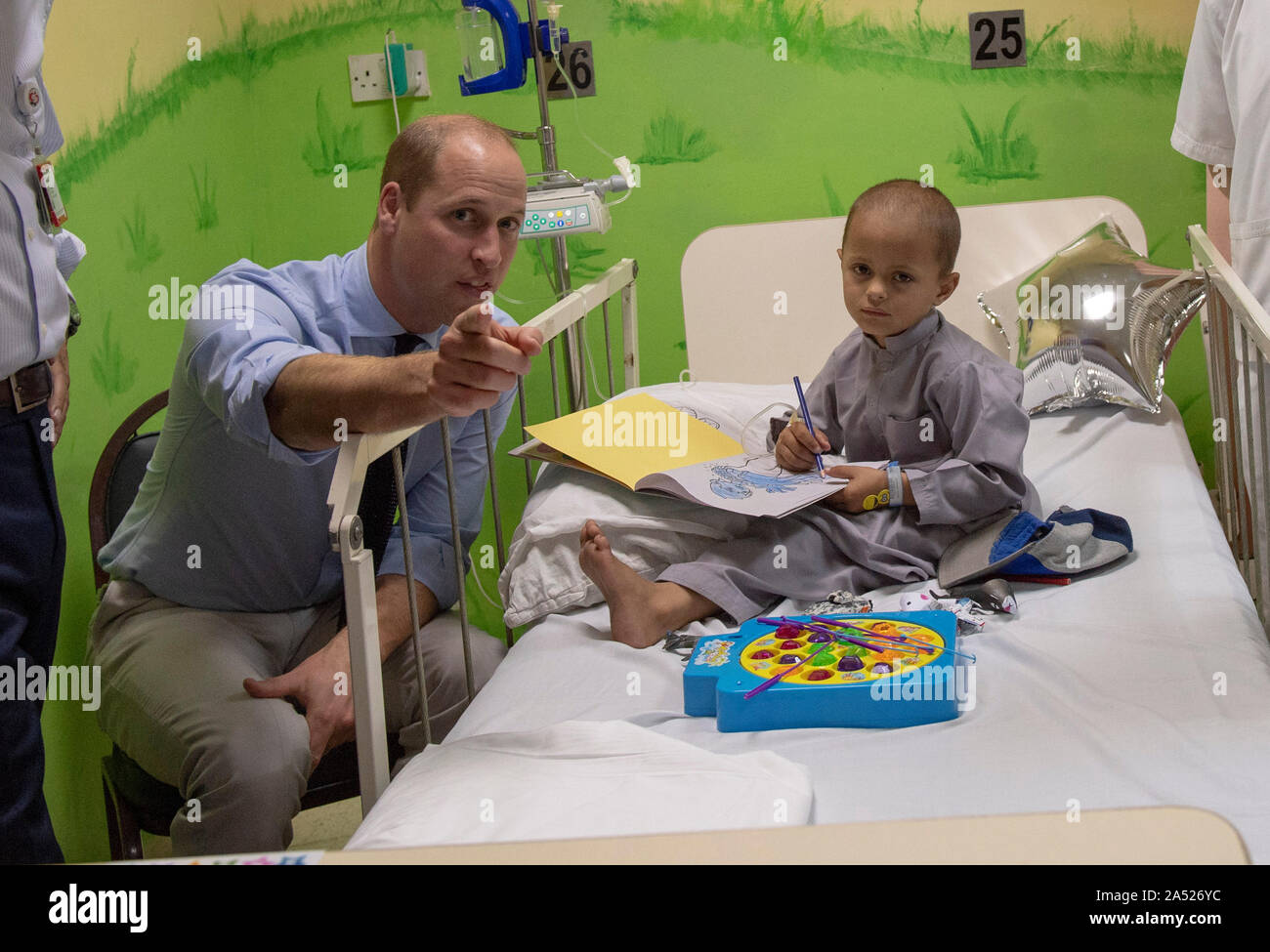The Duke of Cambridge with cancer patient Muhammed Sameer, five, during ...