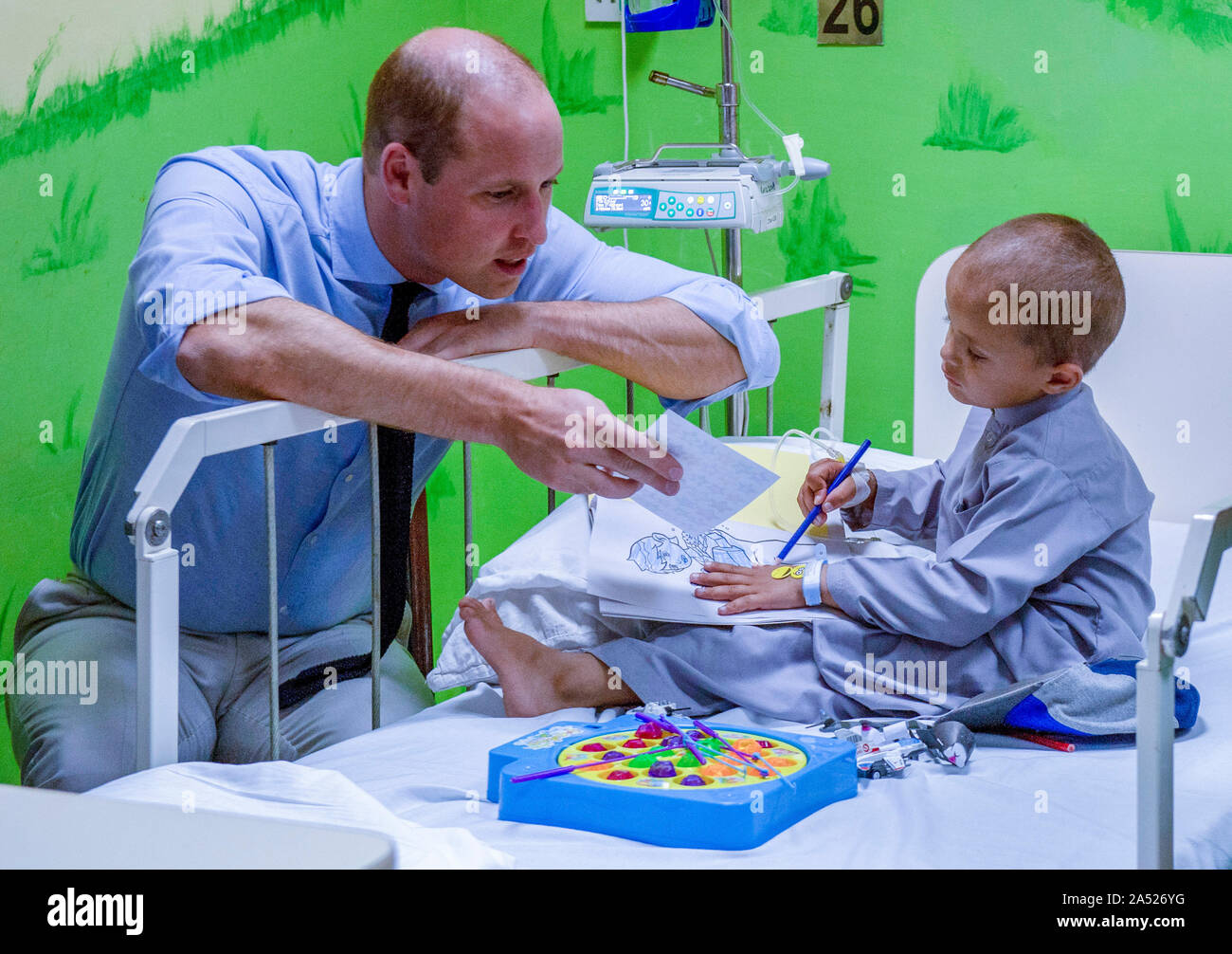 The Duke of Cambridge with cancer patient Muhammed Sameer, five, during ...