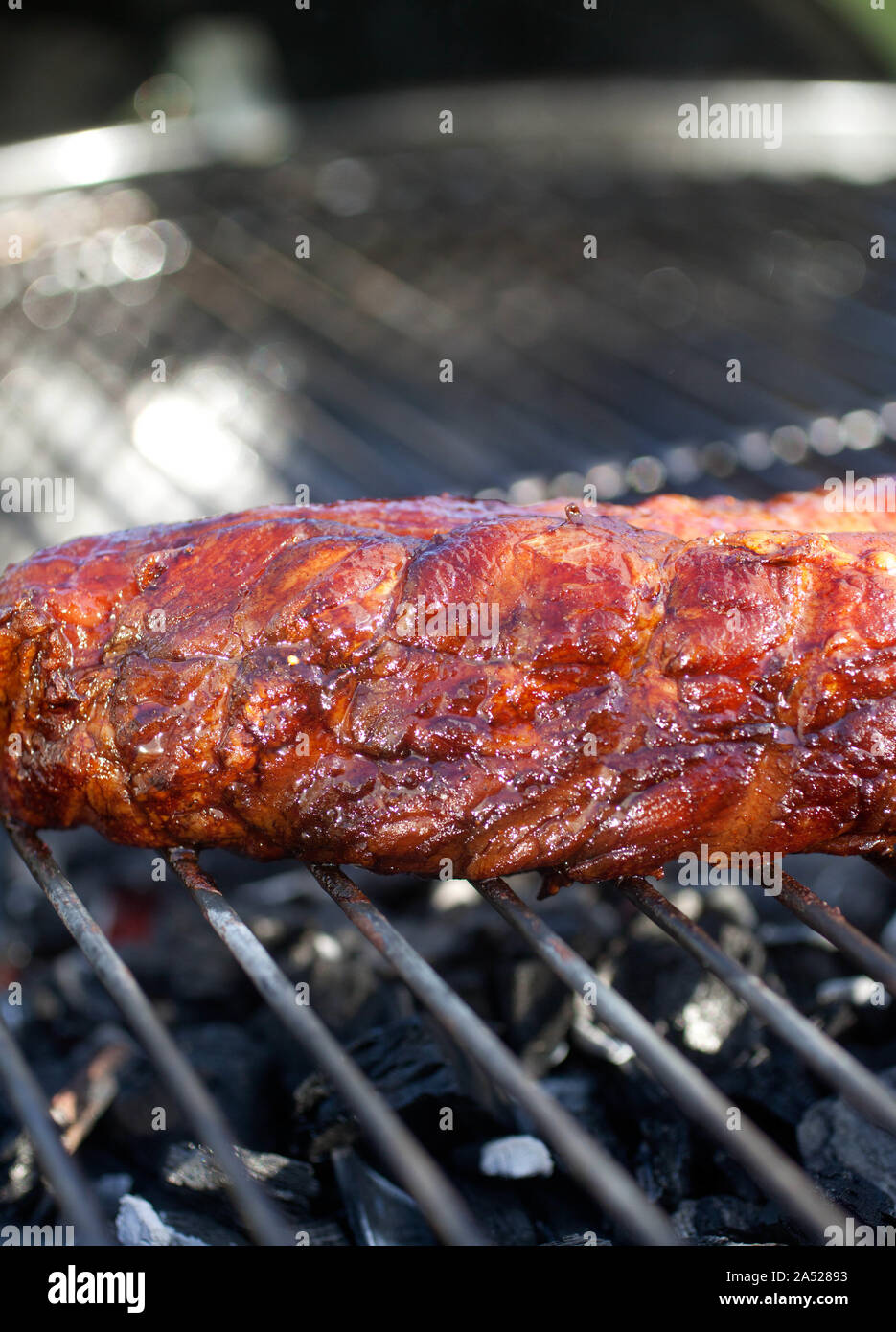 Someone grilling pork fillet on his grill.Photo Jeppe Gustafsson Stock ...