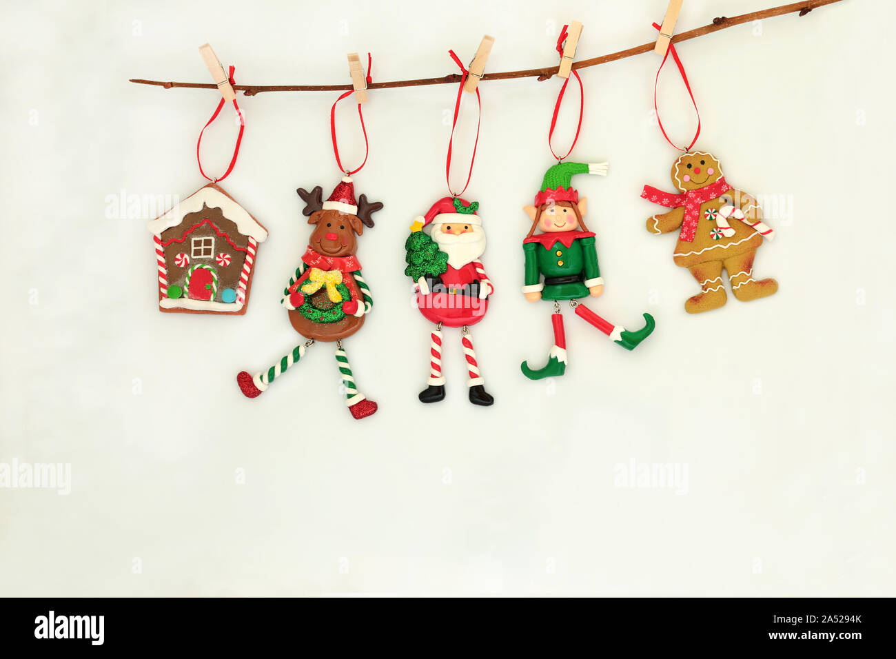 Christmas tree decorations hanging on a branch with santa claus ...