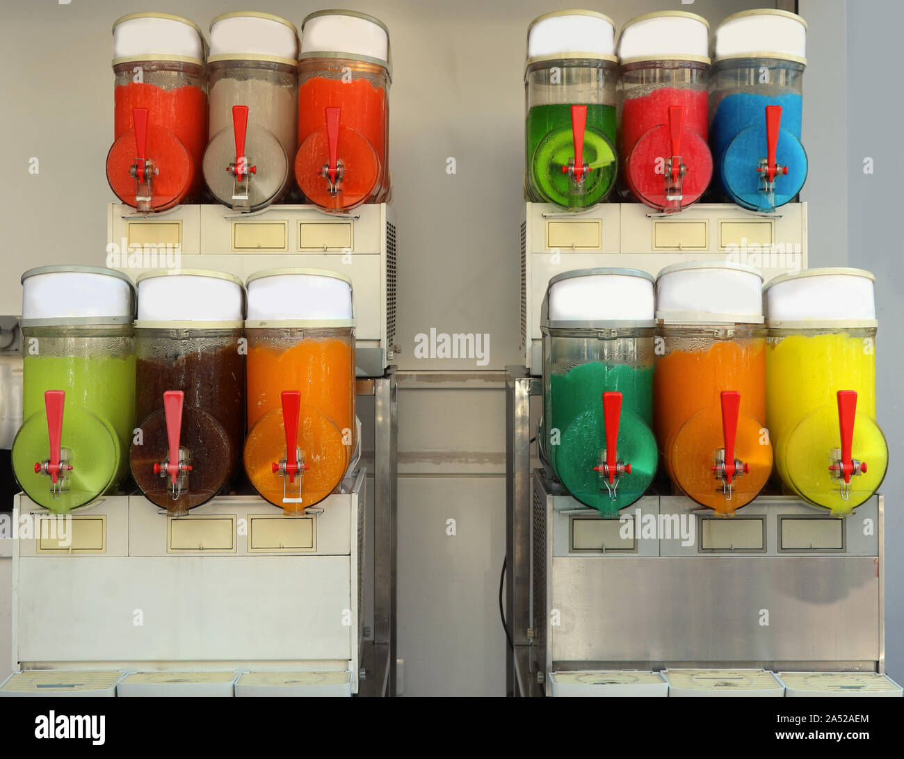 frozen dessert dispenser with sugary syrups with various flavors Stock ...