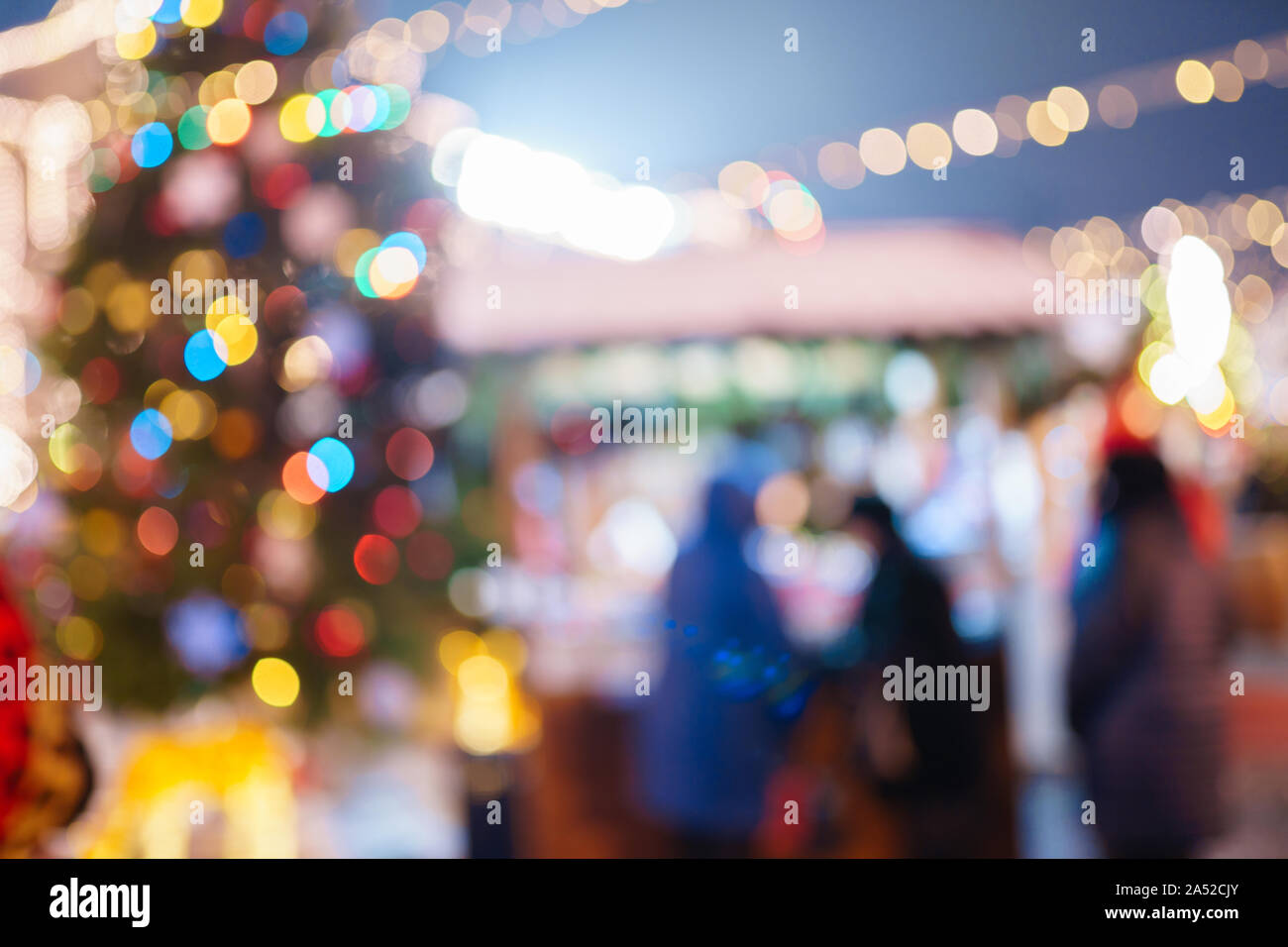 Carousel with burning lights in evening, defocused photo Stock Photo ...