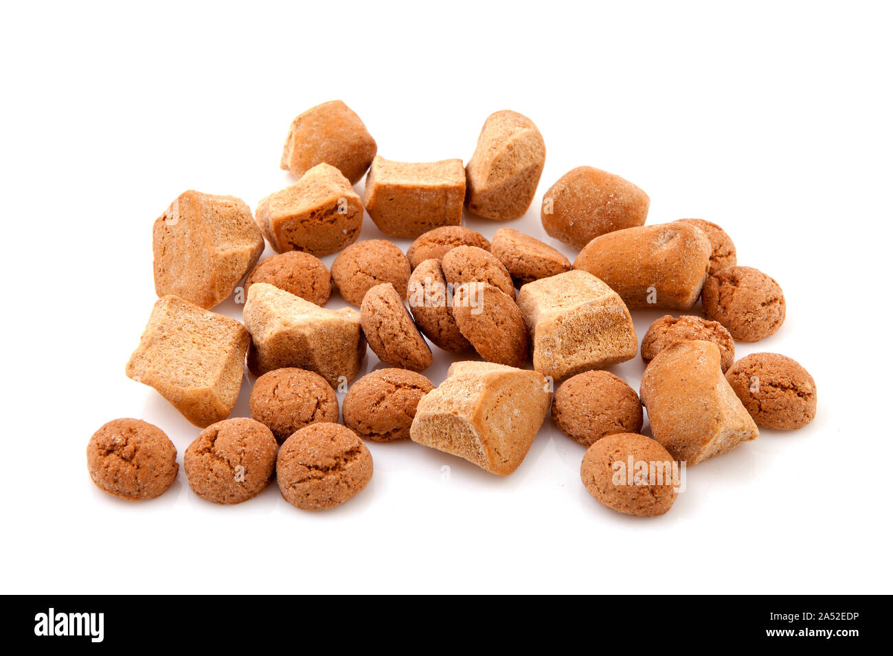 Typical Dutch ginger nuts also known as pepernoten over white ...
