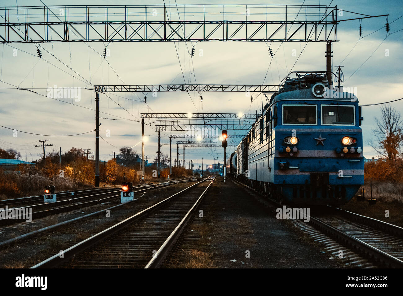 Train moves on tracks in evening.Railway transportation, passenger ...