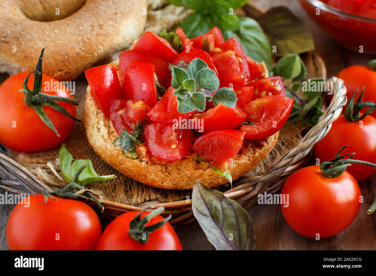 Frisella, typical south italian bread seasond with tomatoes and herbs ...