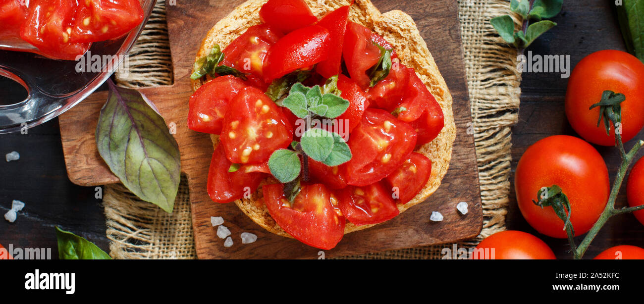 Frisella, typical south italian bread seasond with tomatoes and herbs ...