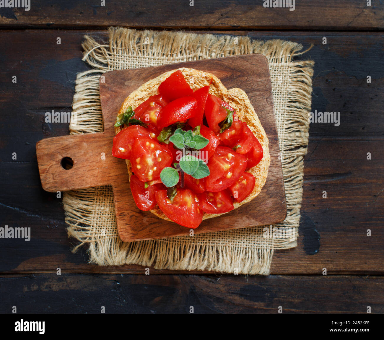 Frisella, typical south italian bread seasond with tomatoes and herbs ...