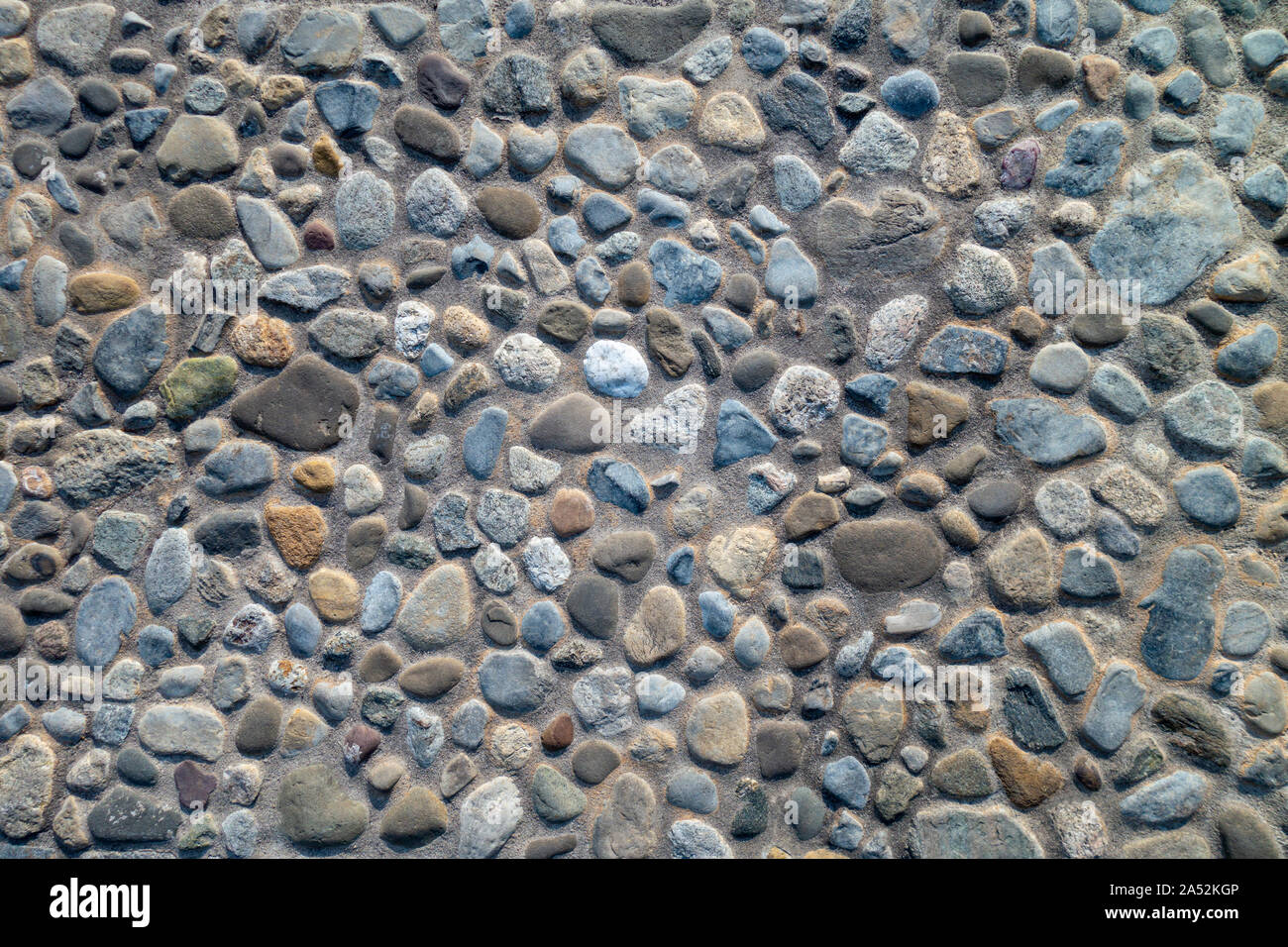 cemented small pebble round stone rock wall or floor Stock Photo - Alamy