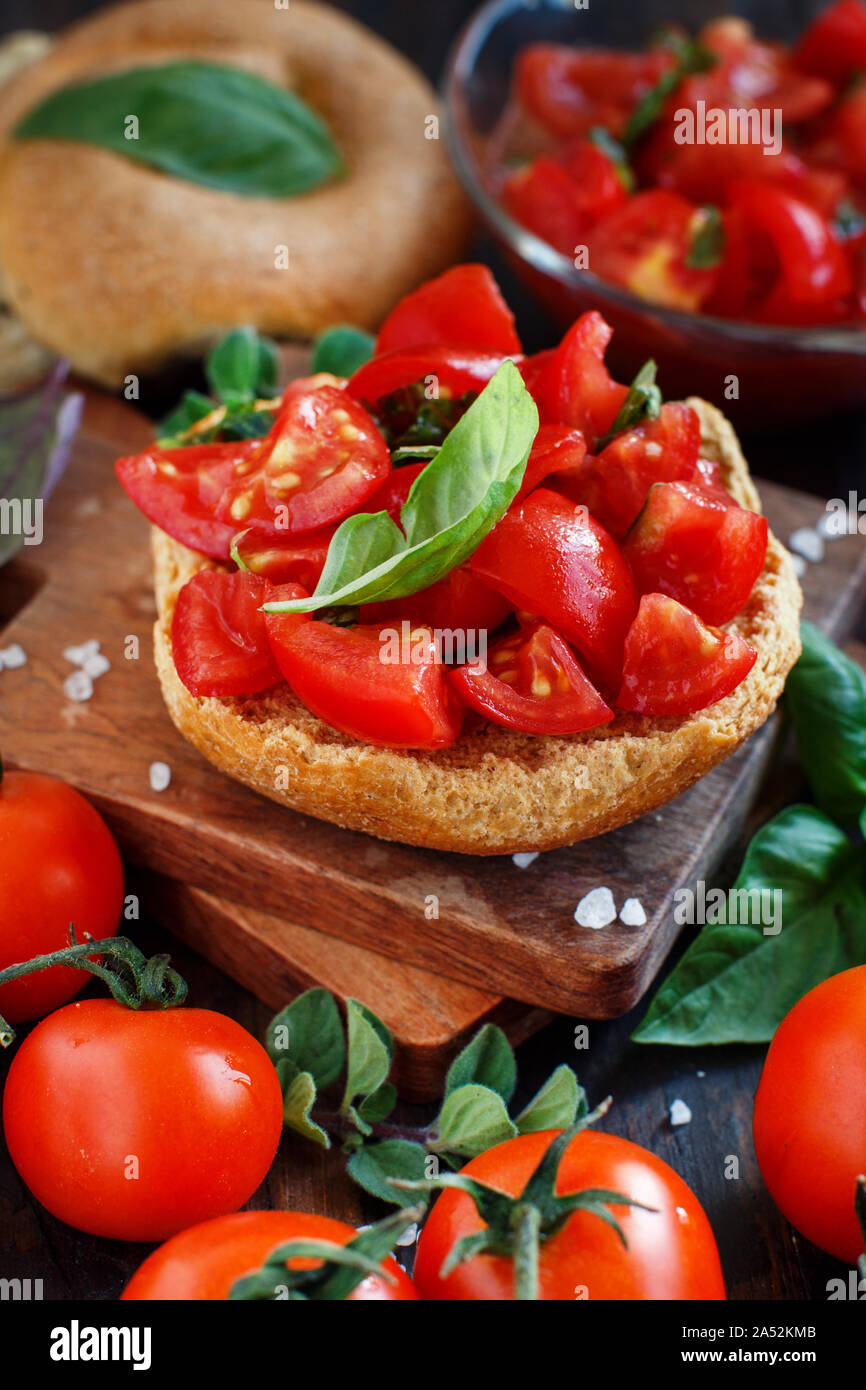 Frisella, typical south italian bread seasond with tomatoes and herbs ...
