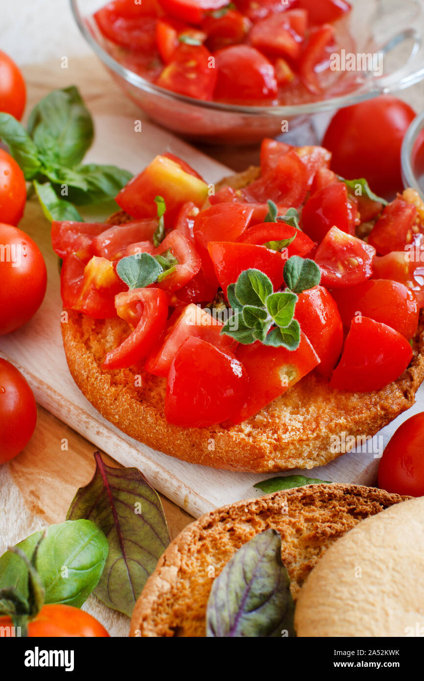 Frisella, typical south italian bread seasond with tomatoes and herbs ...