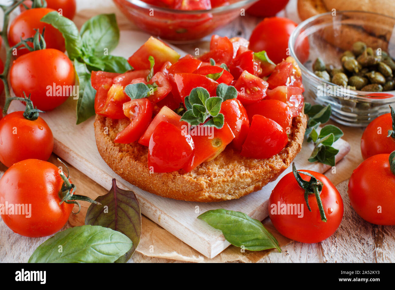 Frisella, typical south italian bread seasond with tomatoes and herbs ...