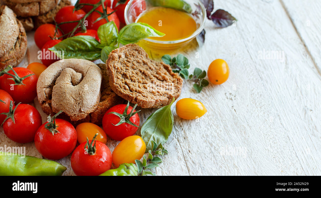 Frisella, typical south italian bread with vegetabes and olive oil ...