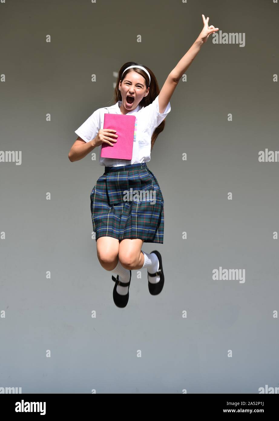 Happy Excited Student Female Jumping Stock Photo - Alamy