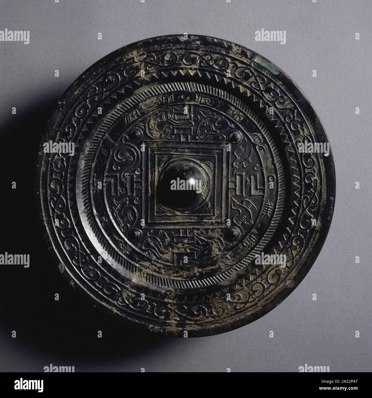 TLV Mirror, early 1st Century - early 3rd Century. The mirror was cast ...
