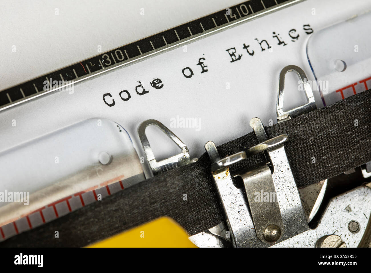 old typewriter with text code of ethics Stock Photo - Alamy