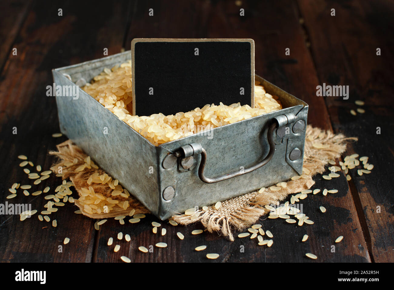 Parboiled rice with a small chalkboard in a box close up Stock Photo ...