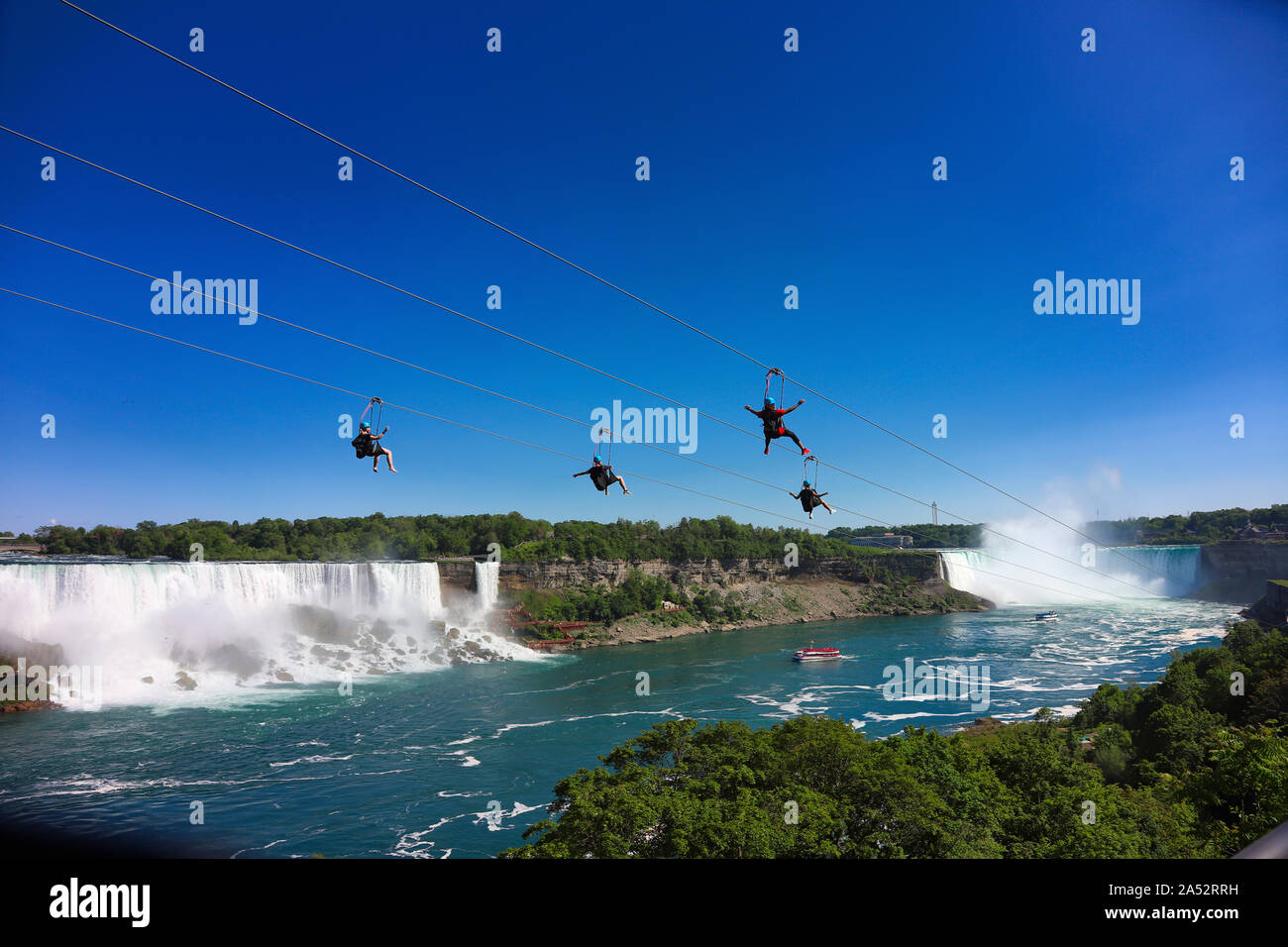 Tourists flying on zipline over Niagara Falls Stock Photo - Alamy