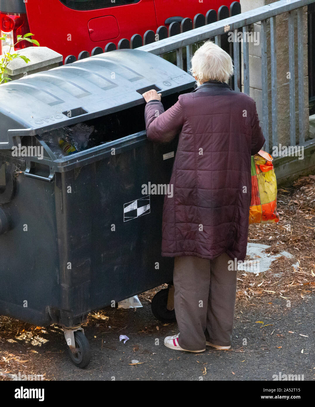 homeless man searching the trash Stock Photo - Alamy