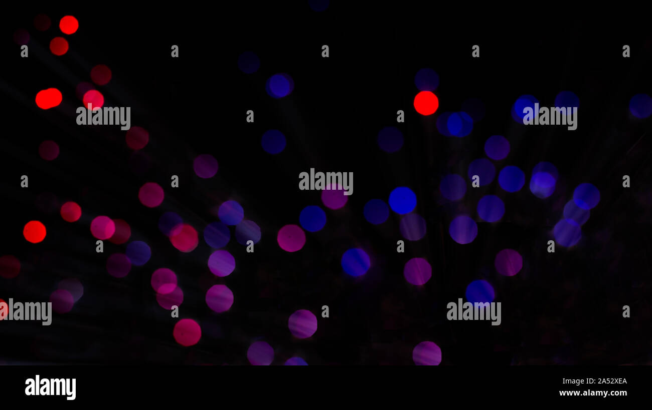 Red, purple and blue lights for celebration on a dark background Stock ...