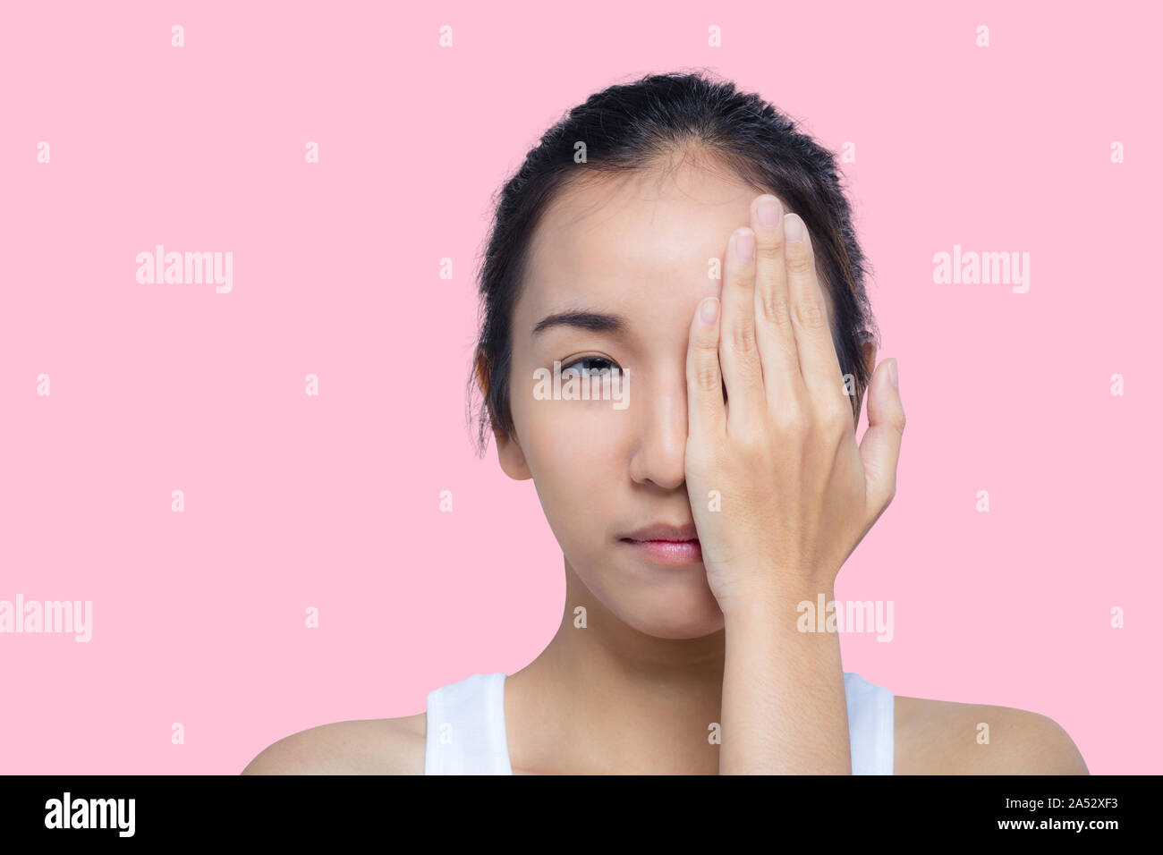 Woman make hand covering her face One side Stock Photo - Alamy