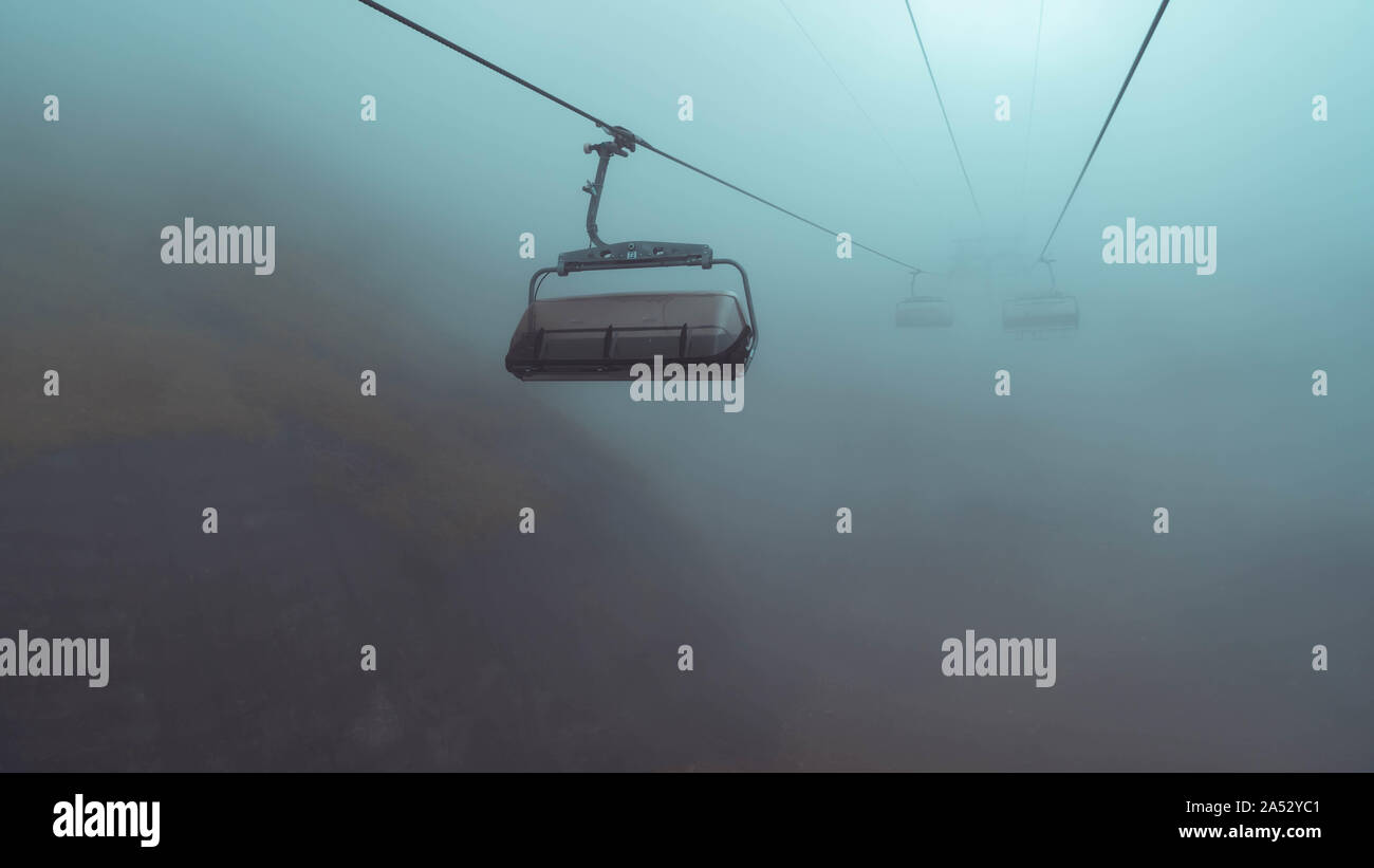 Creepy cable car in dark fog Stock Photo - Alamy